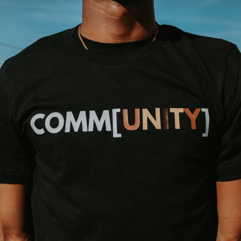 Our COMM[UNITY] Tee – Unchained Memories